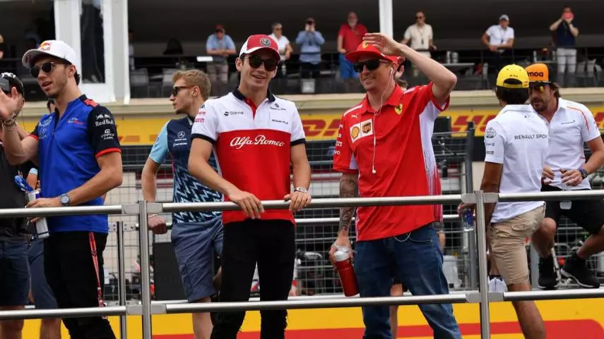 Kimi Raikkonen at Charles Leclerc