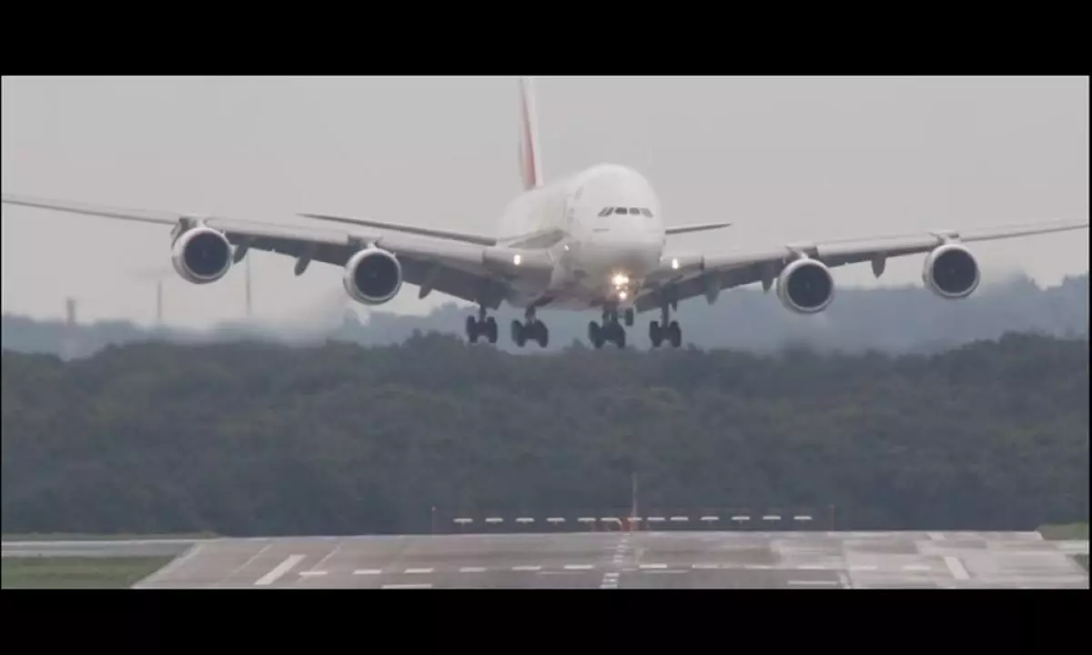 The world's largest plane lands in a crosswind